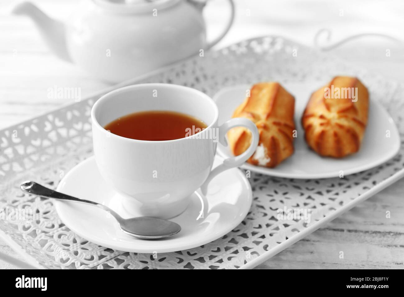 Tea with pastries filled with custard on the tray Stock Photo - Alamy