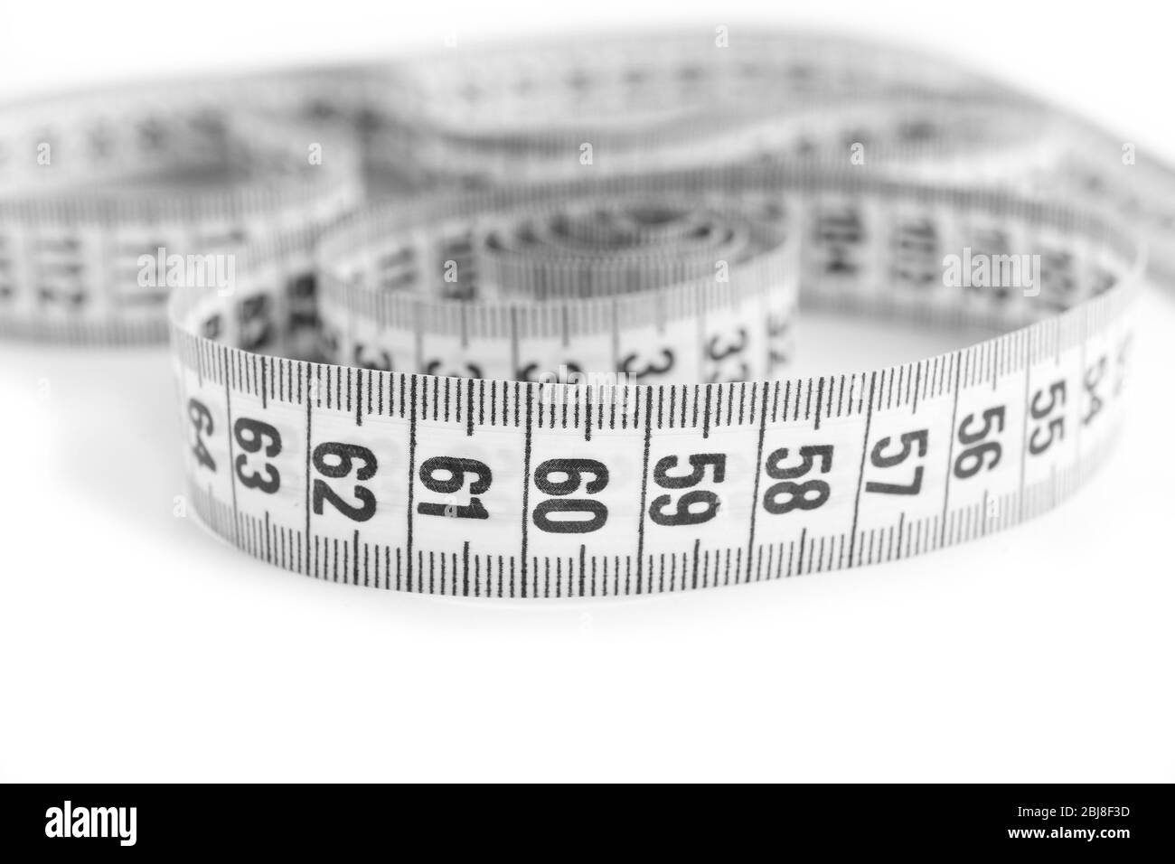 Measuring tape on white background Stock Photo - Alamy