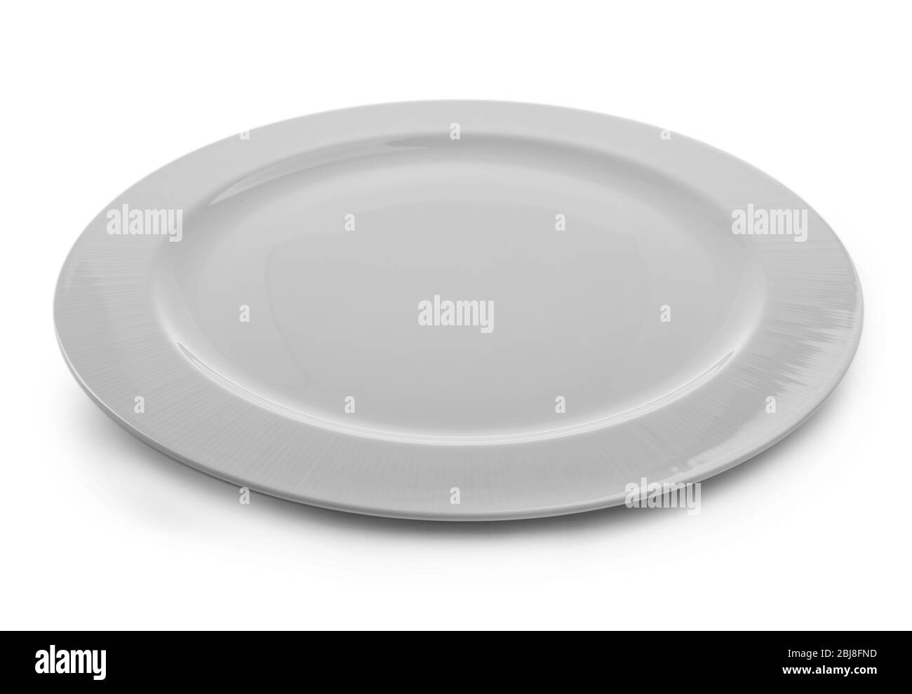 Round ceramic plate, isolated on white Stock Photo - Alamy