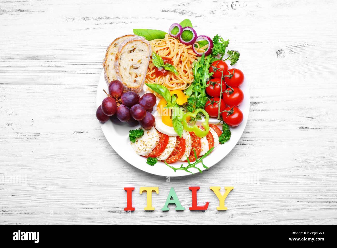 Traditional Italian lunch on white wooden background Stock Photo - Alamy