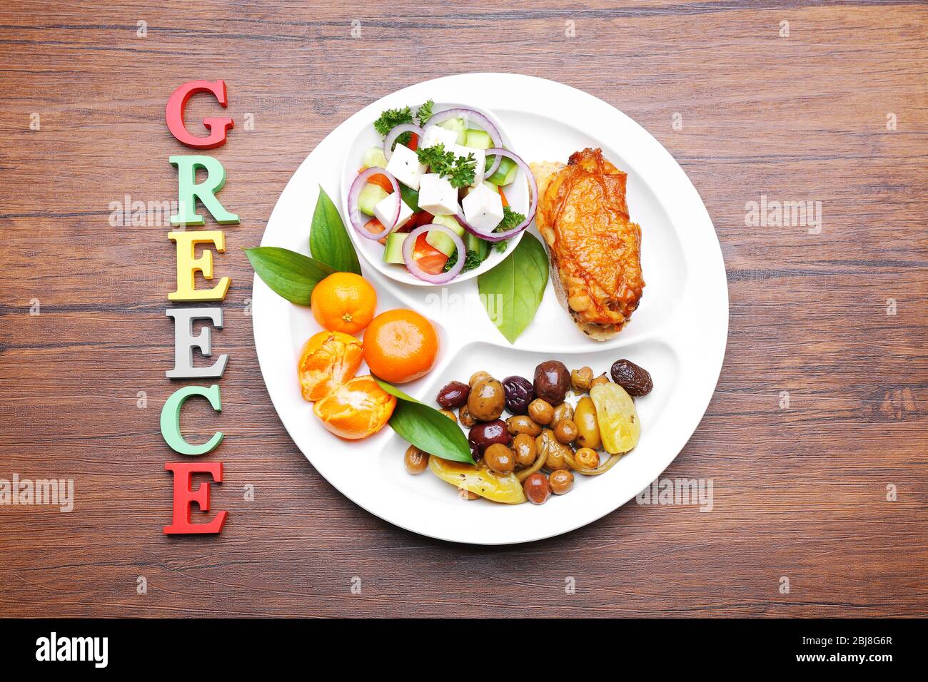 Traditional Greek lunch on wooden background Stock Photo - Alamy