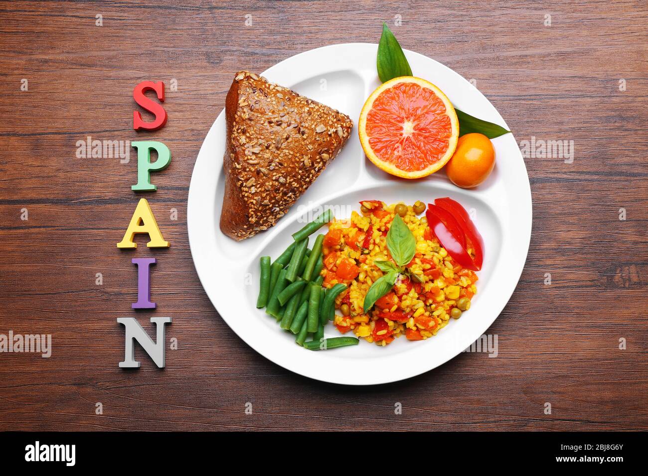 Traditional Spanish lunch on wooden background Stock Photo - Alamy