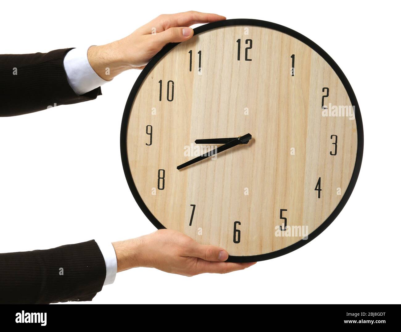 Male hands holding big clock on white background Stock Photo - Alamy