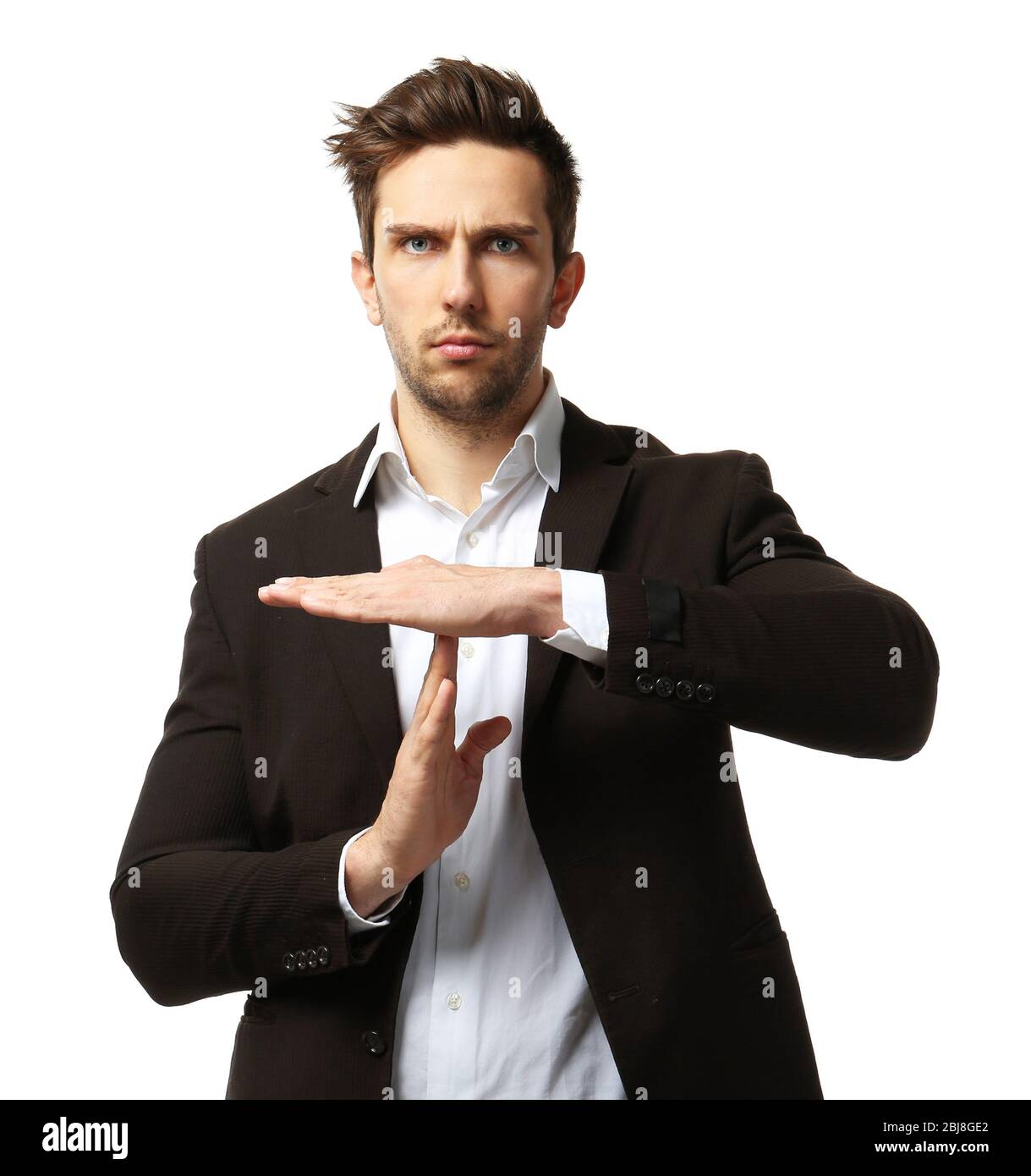 Young man gesturing time out sign on the white background Stock Photo ...