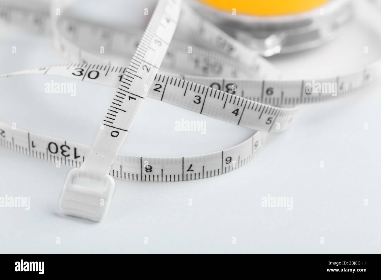 Yellow gray tape measure hi-res stock photography and images - Alamy