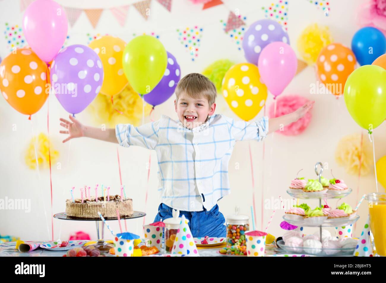 Happy cute little boy having fun at birthday party Stock Photo - Alamy