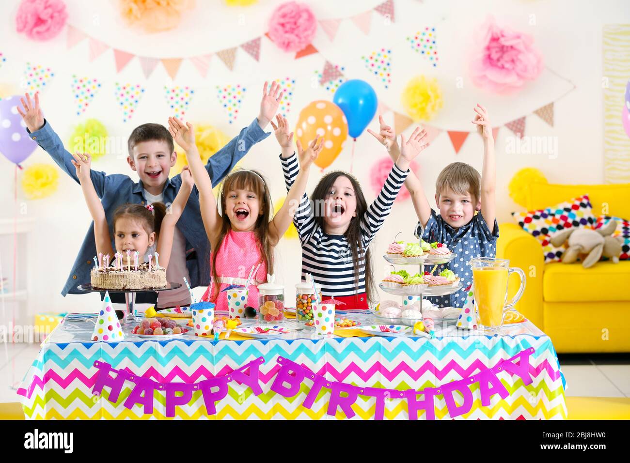 Happy group of children having fun at birthday party Stock Photo - Alamy