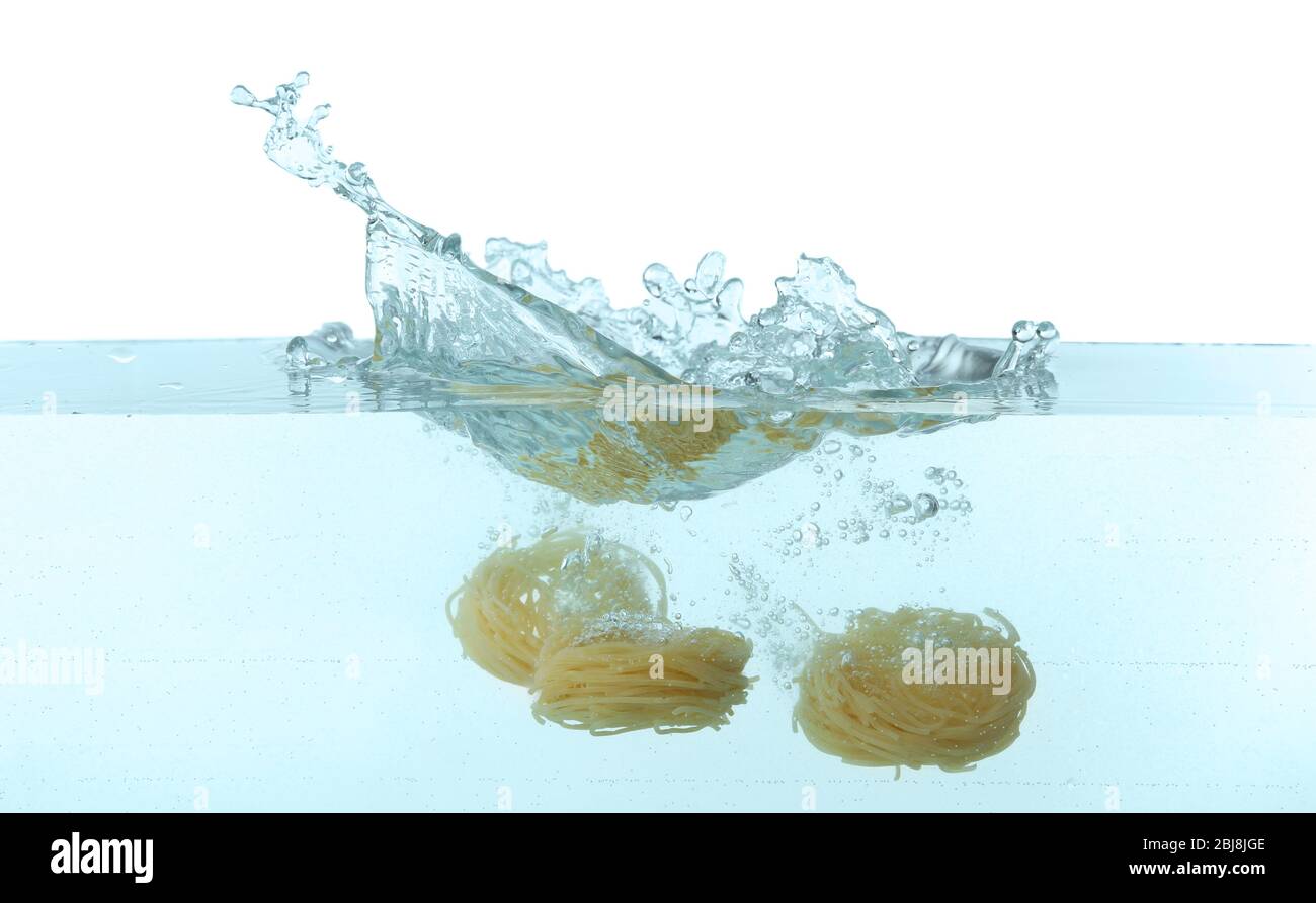 Noodles falling in water Stock Photo - Alamy
