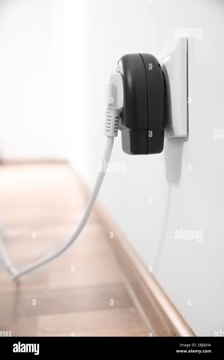 Electric plug in socket Stock Photo - Alamy