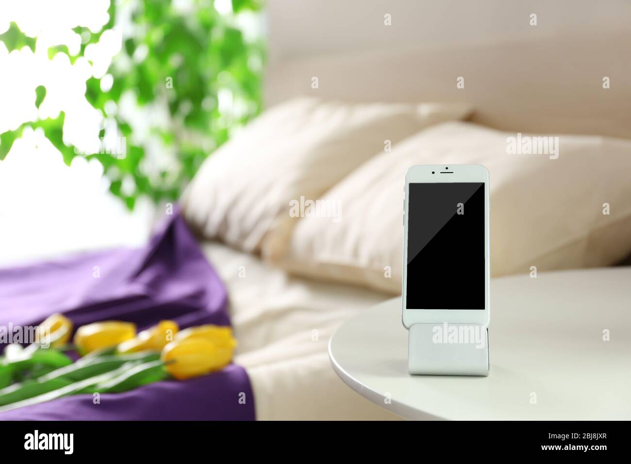 Mobile phone on bedside table hi-res stock photography and images - Alamy