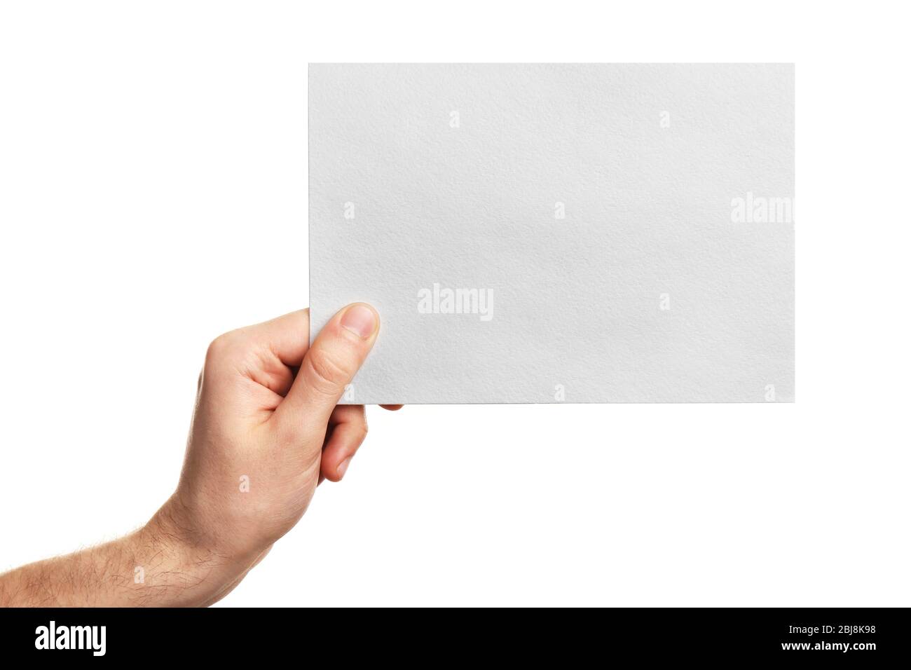 Male hand holding clean sheet of paper, isolated on white Stock Photo ...