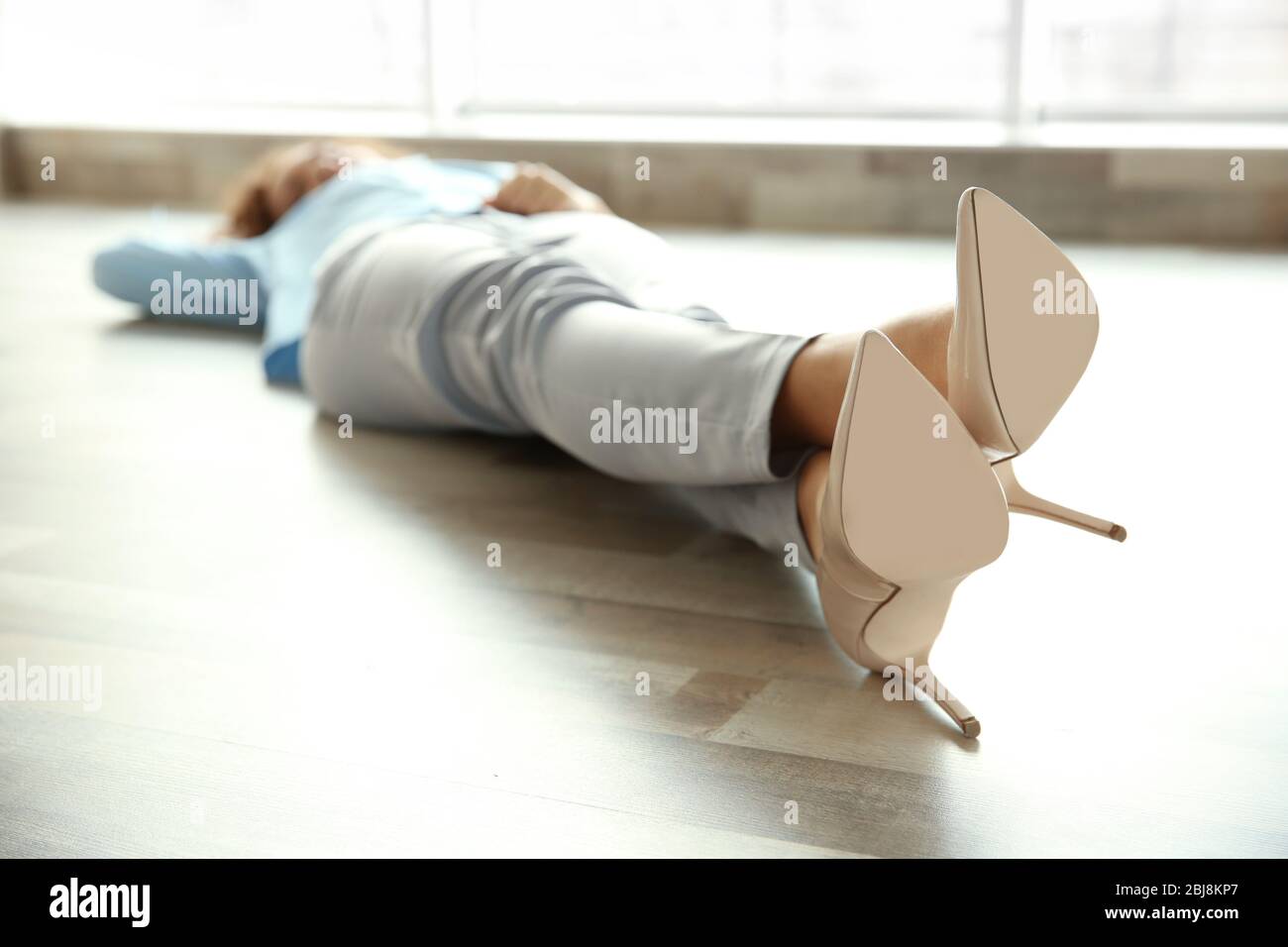 Woman lying on floor feet up hi-res stock photography and images - Alamy