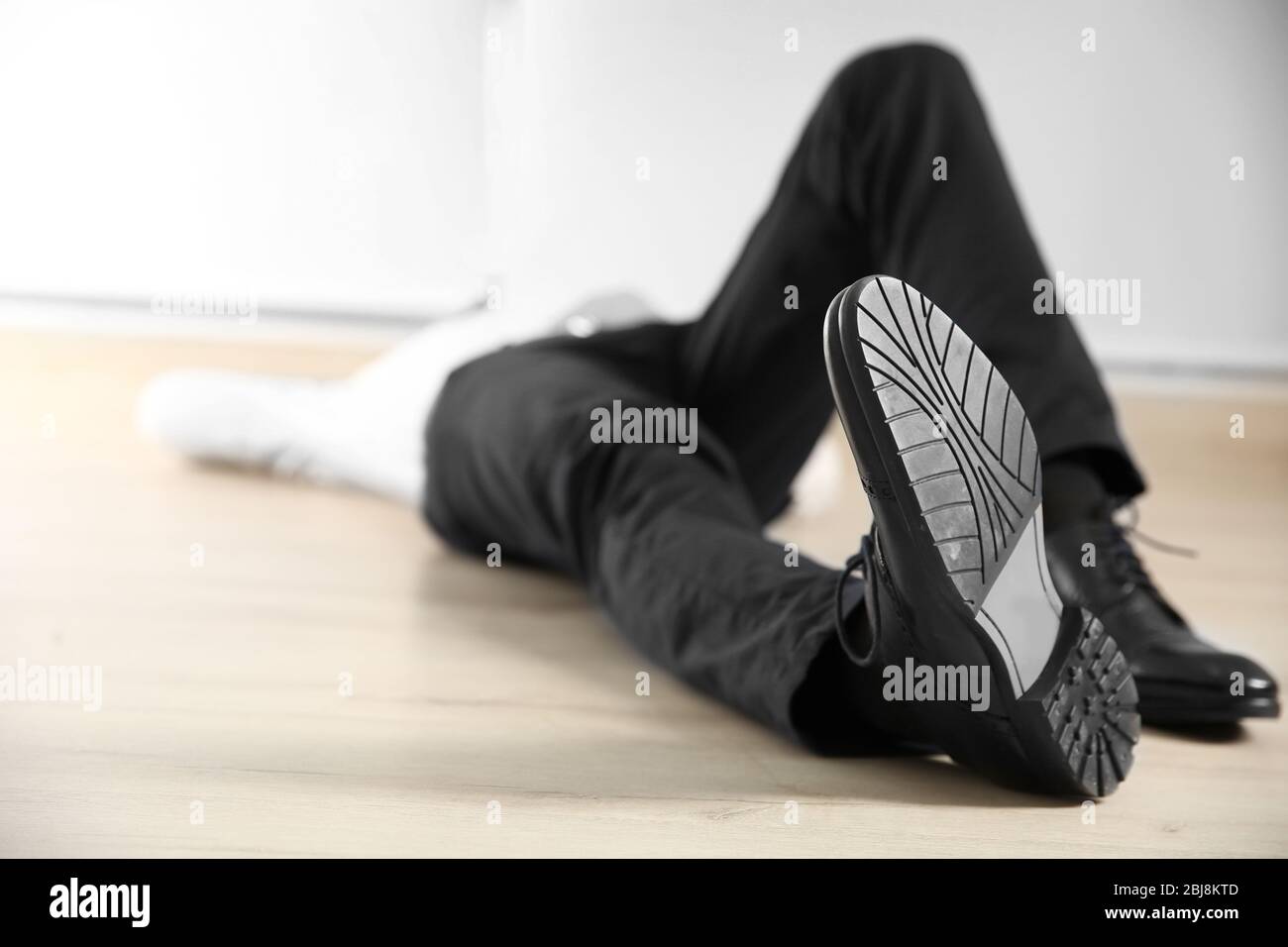 Tired guy lying on floor hi-res stock photography and images - Alamy