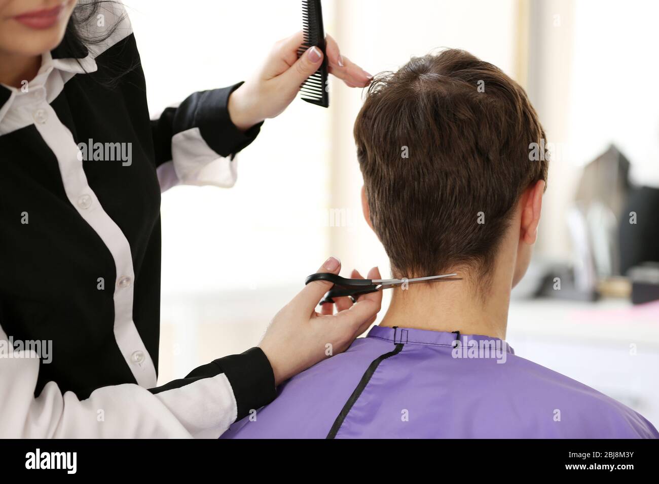 Professional hairdresser making stylish haircut Stock Photo - Alamy