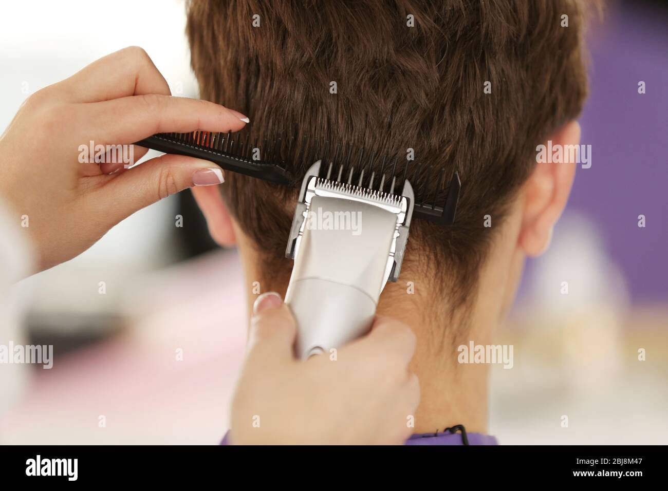 Professional hairdresser making stylish haircut, closeup Stock Photo ...