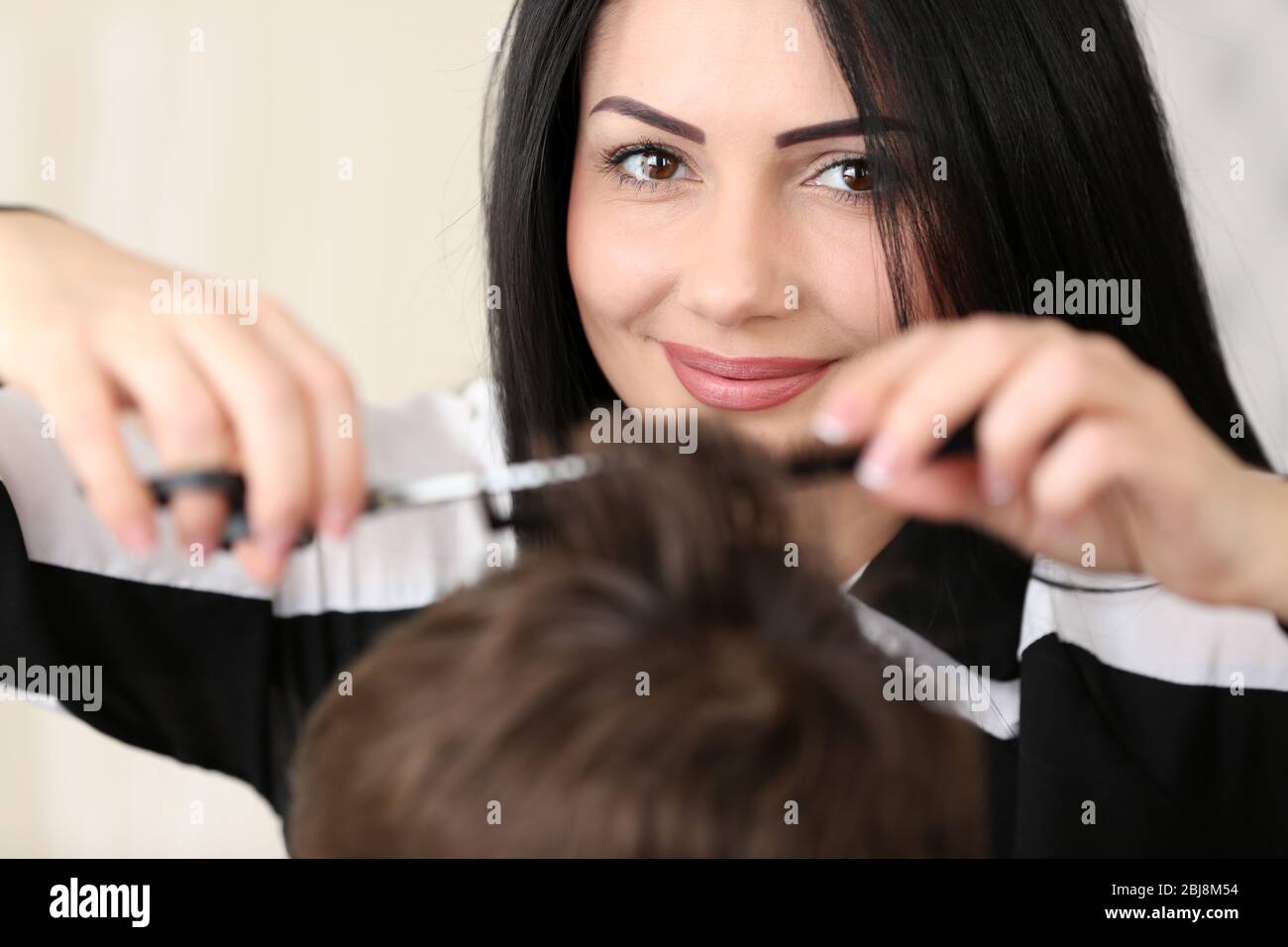 Professional hairdresser making stylish haircut Stock Photo - Alamy