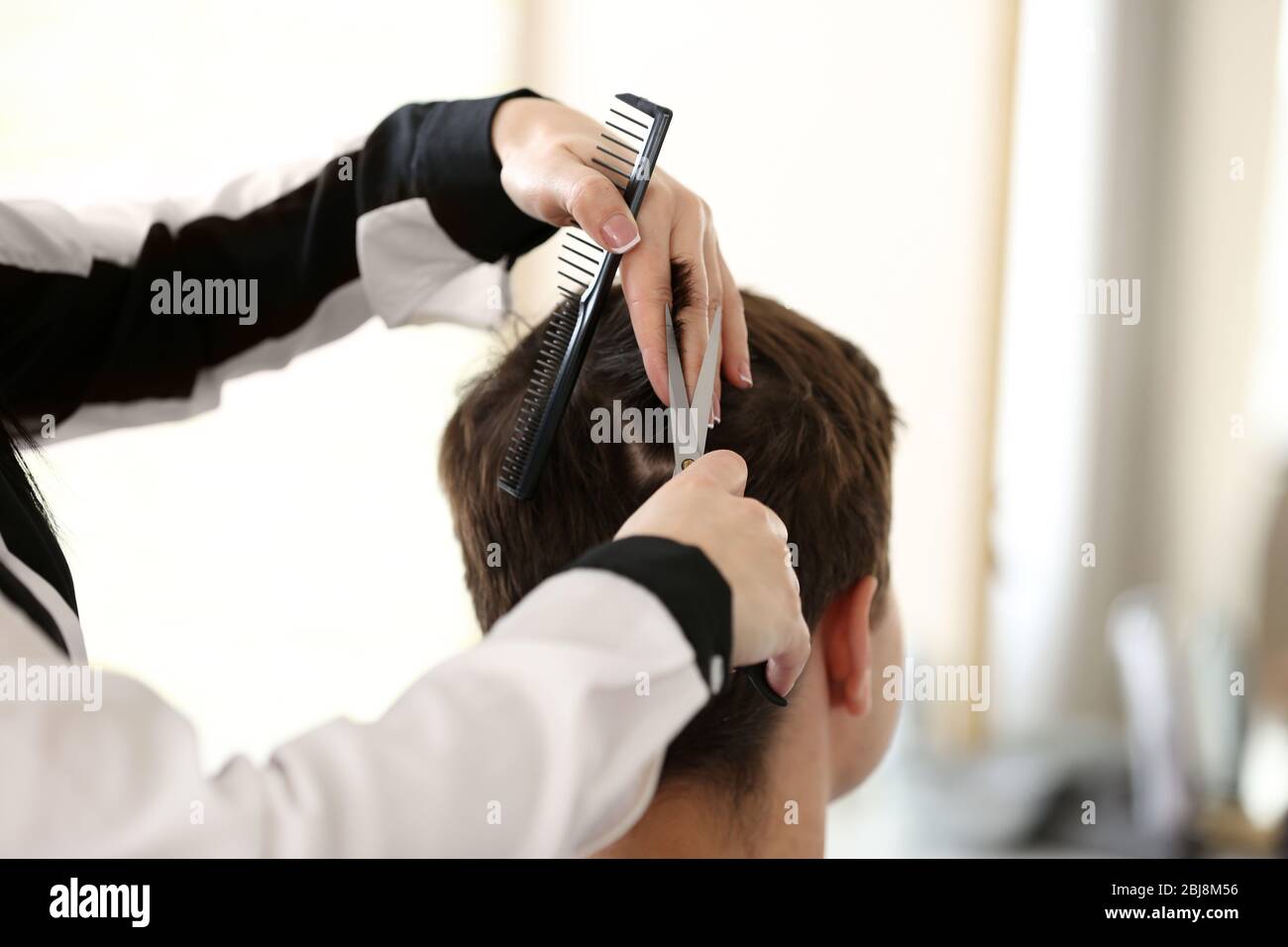 Professional hairdresser making stylish haircut Stock Photo - Alamy