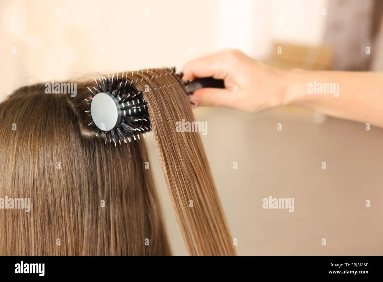 Professional hairdresser drying hair Stock Photo - Alamy