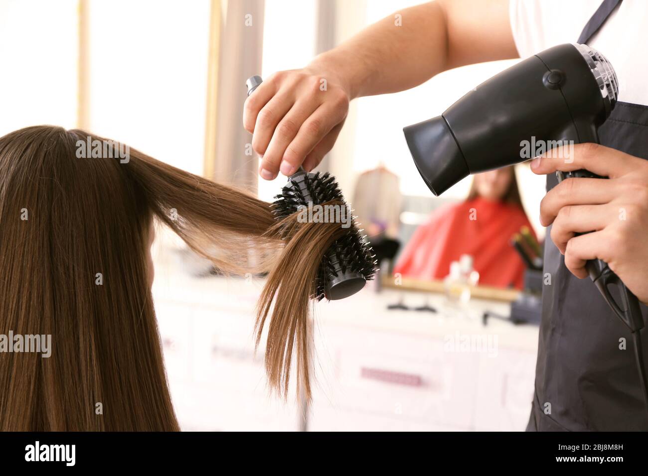 Professional hairdresser drying hair hi-res stock photography and ...