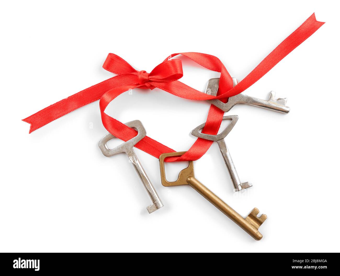Four keys on red ribbon, isolated on white Stock Photo - Alamy