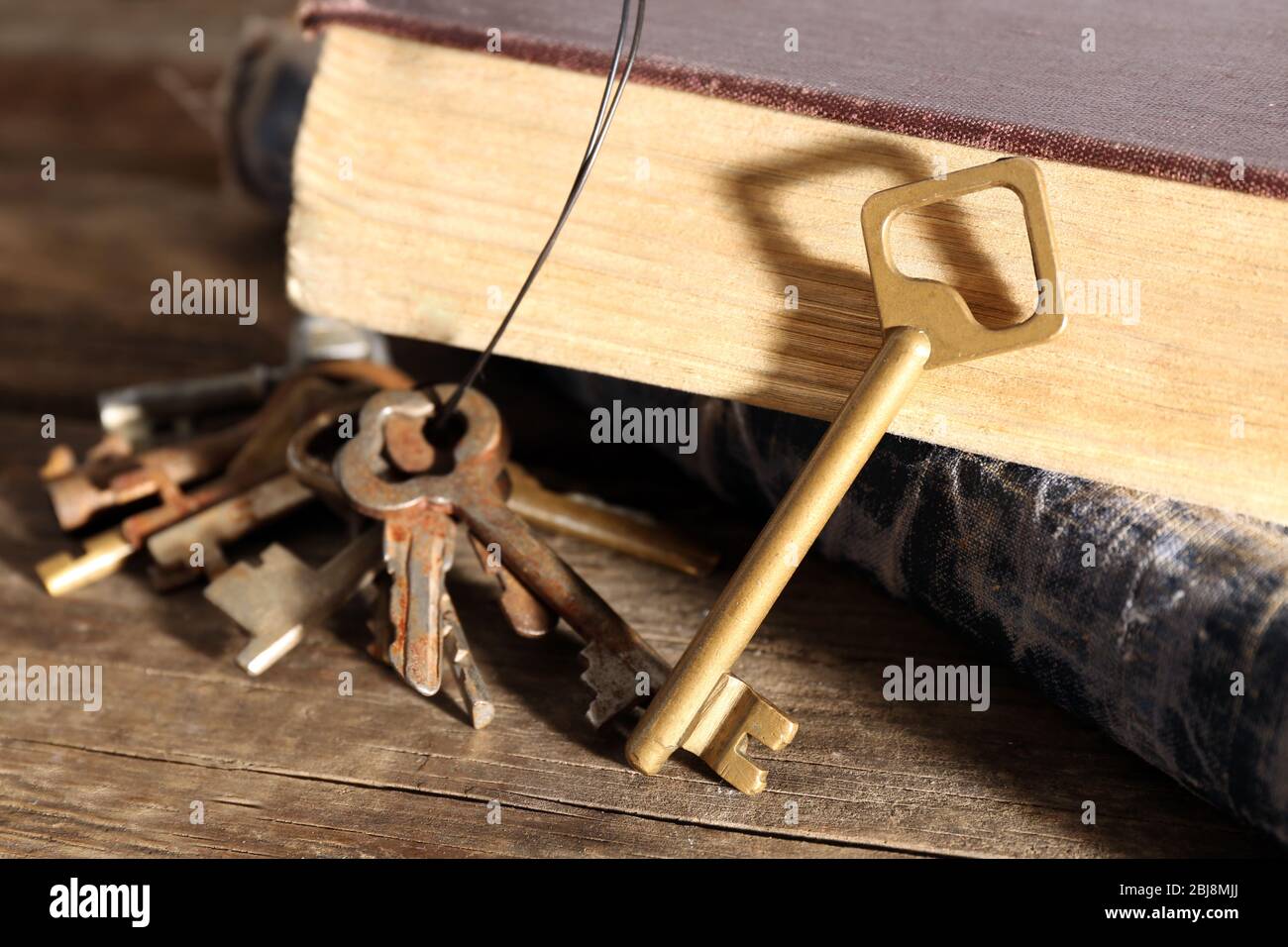 Bunch of old keys and books on wooden background Stock Photo - Alamy