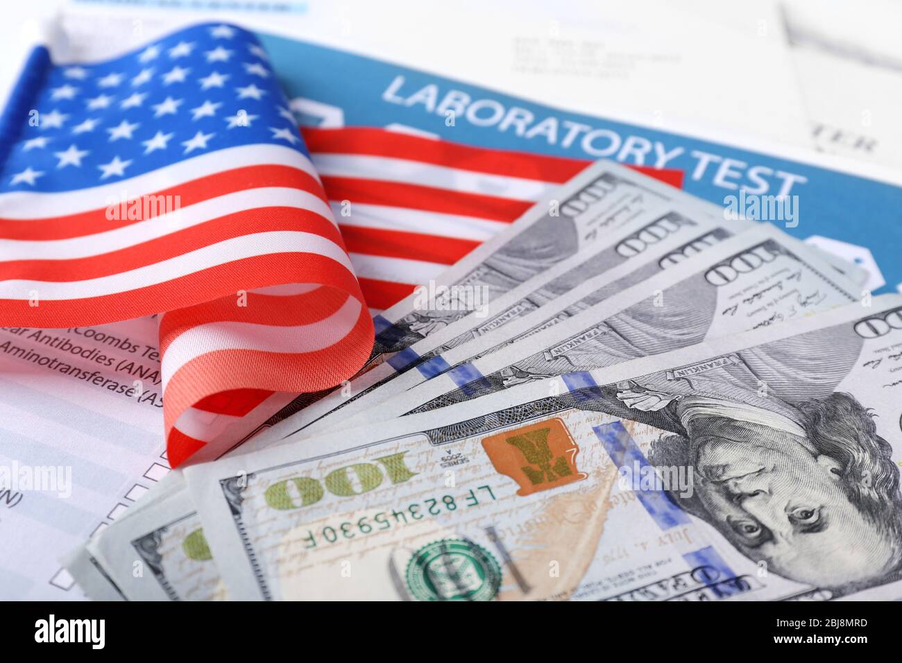 Dollar banknotes with form of laboratory test and American flag, close ...