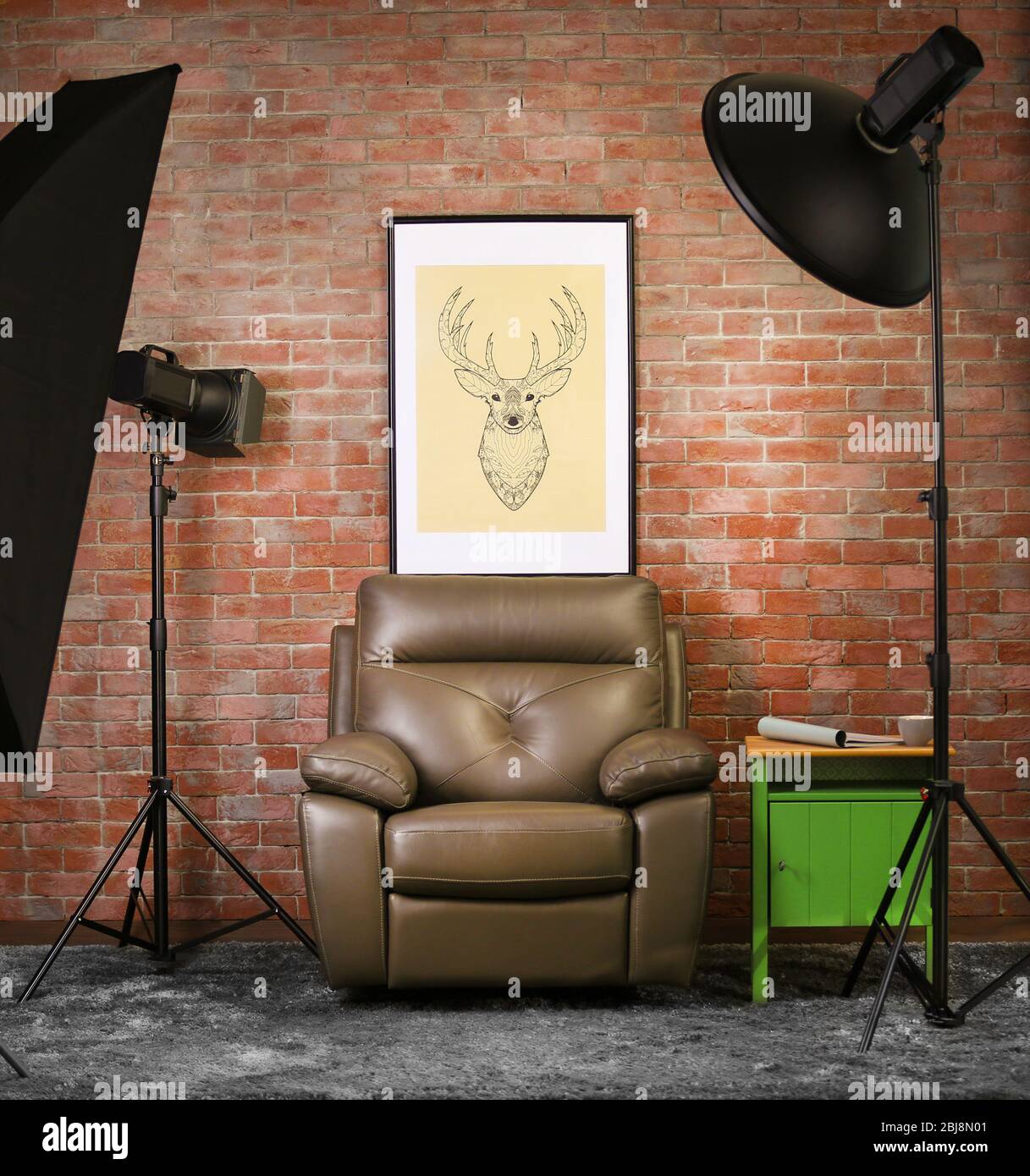 Photo studio interior on brick wall background Stock Photo - Alamy