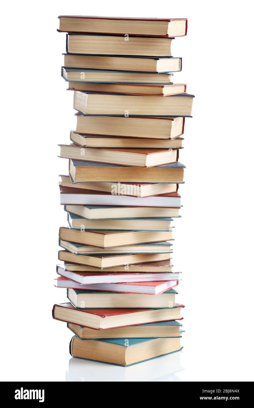 High stack of books, isolated on white Stock Photo - Alamy