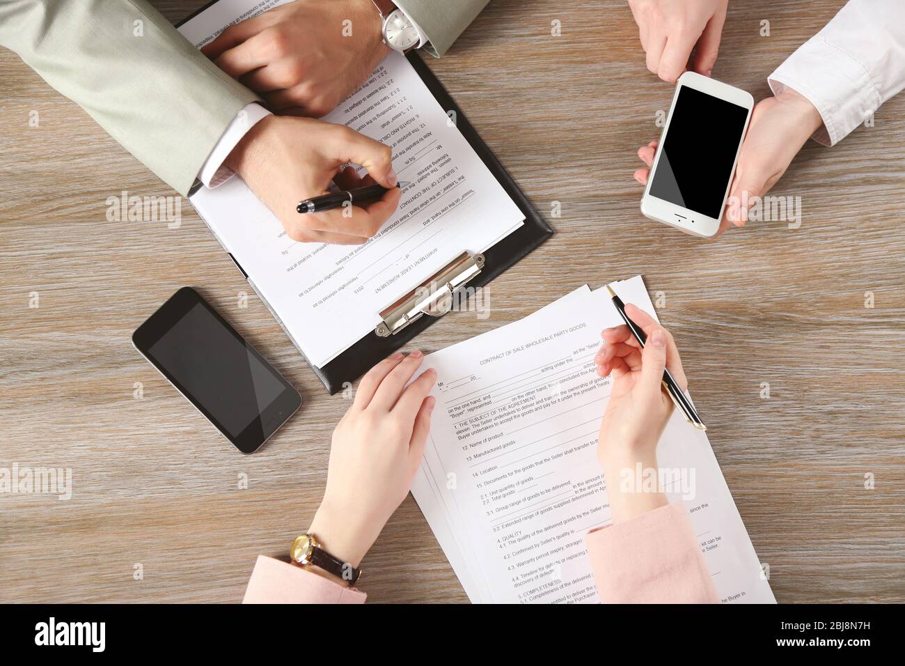 Human hands working with documents at the desk, top view Stock Photo ...