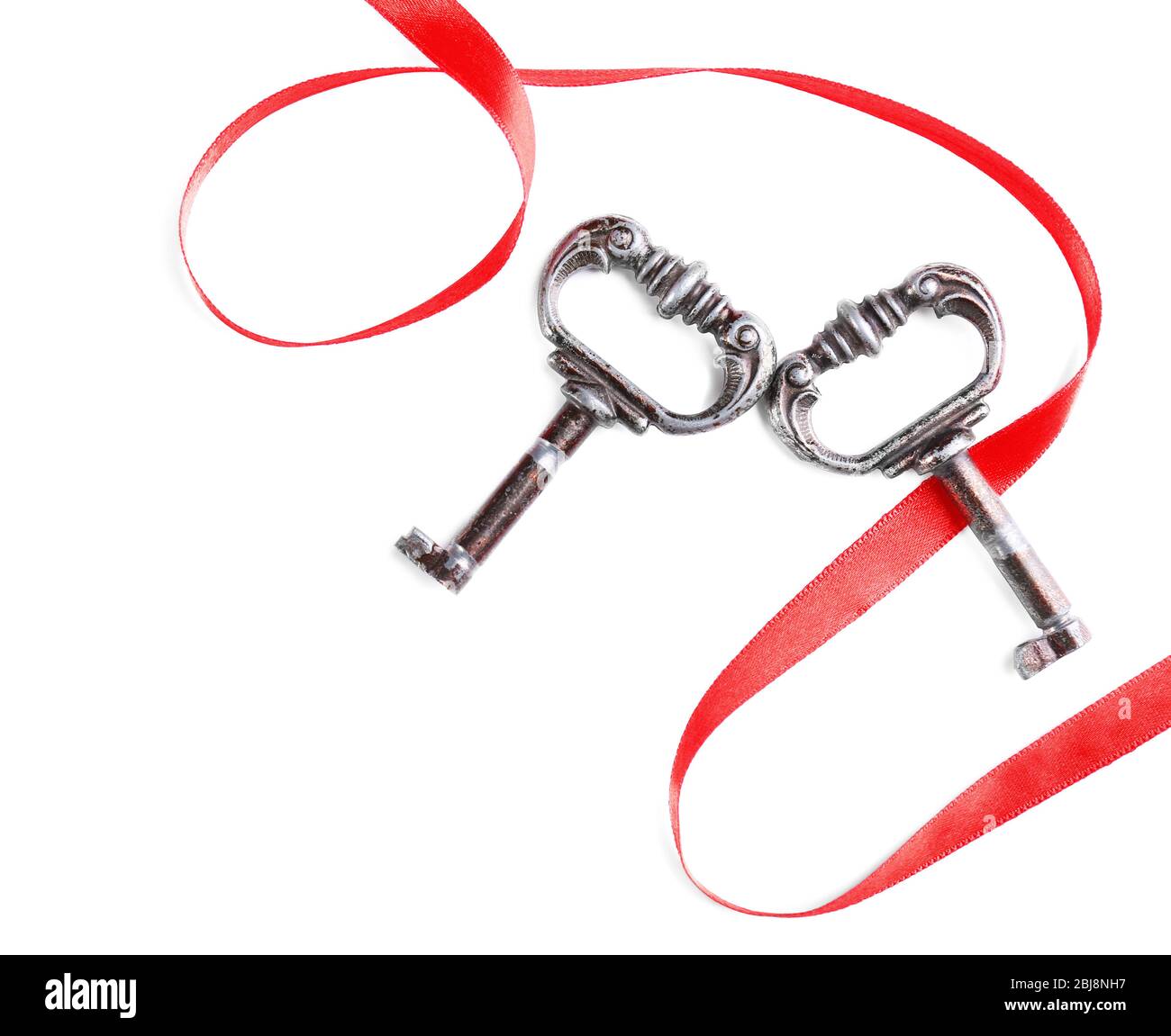 Two vintage keys with a red ribbon on a white background Stock Photo ...