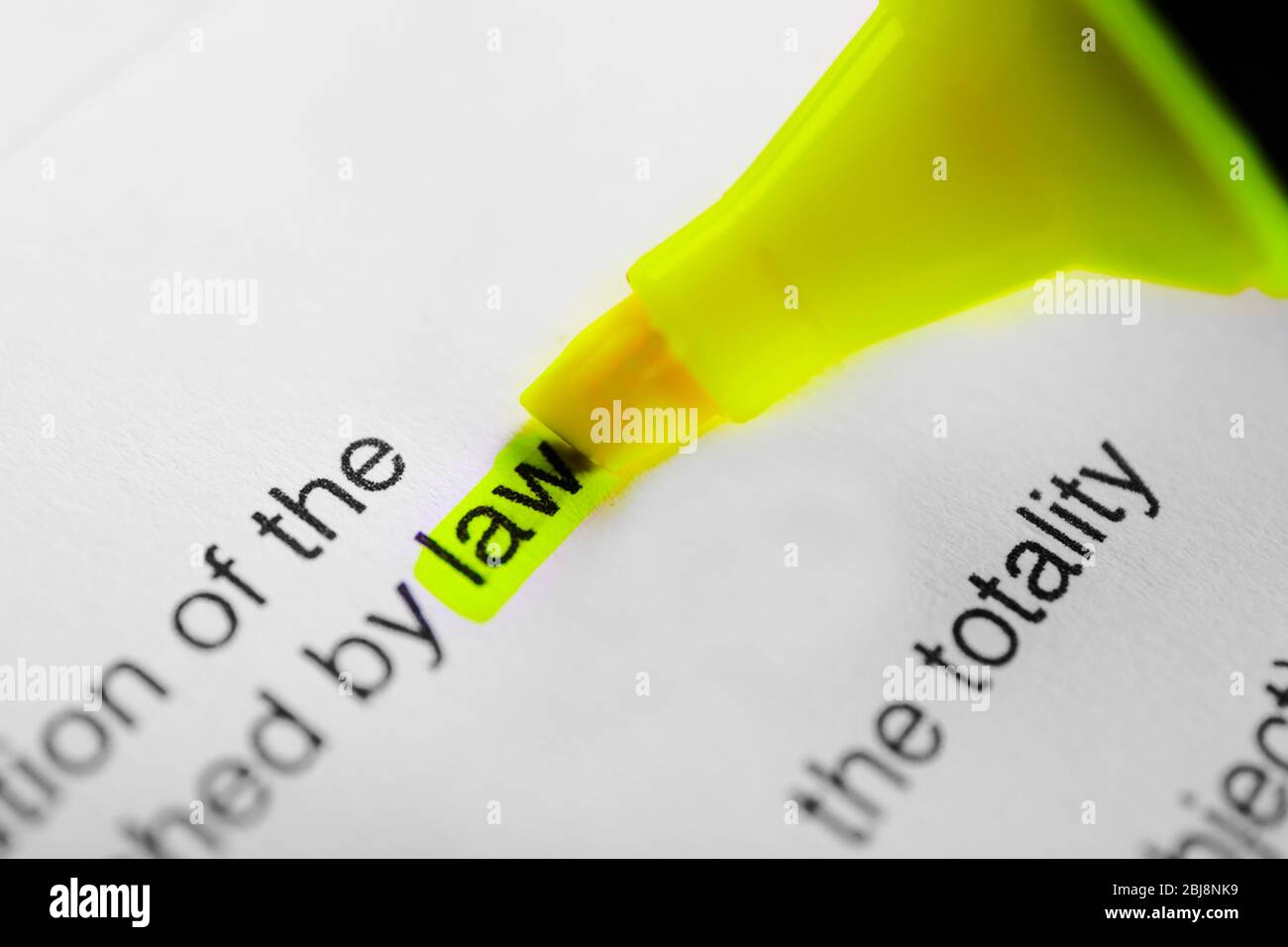 Word law highlighted with a yellow marker Stock Photo - Alamy