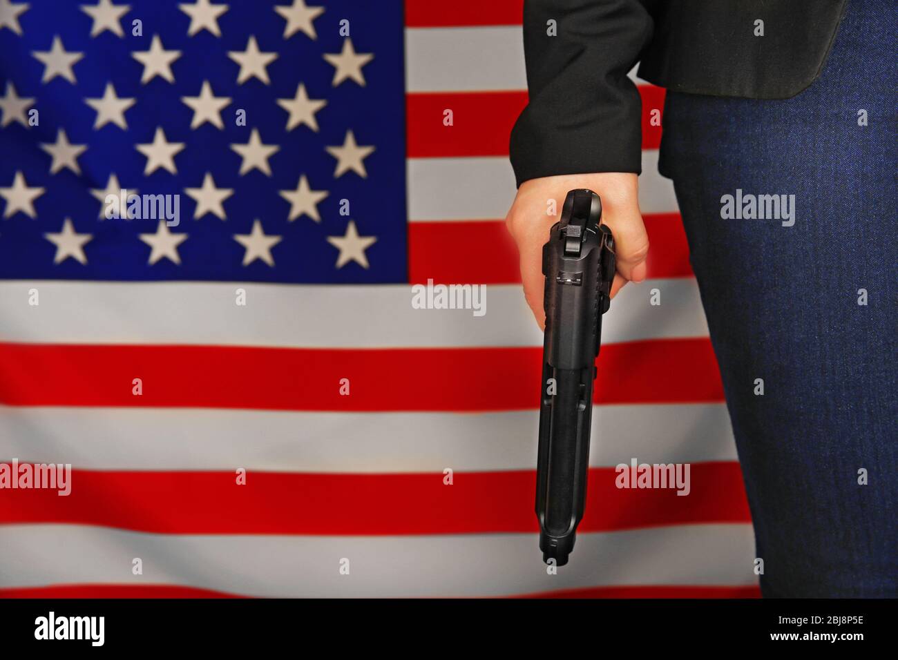 Woman holding gun hi-res stock photography and images - Alamy