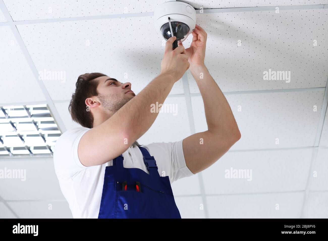 Professional CCTV technician working Stock Photo - Alamy