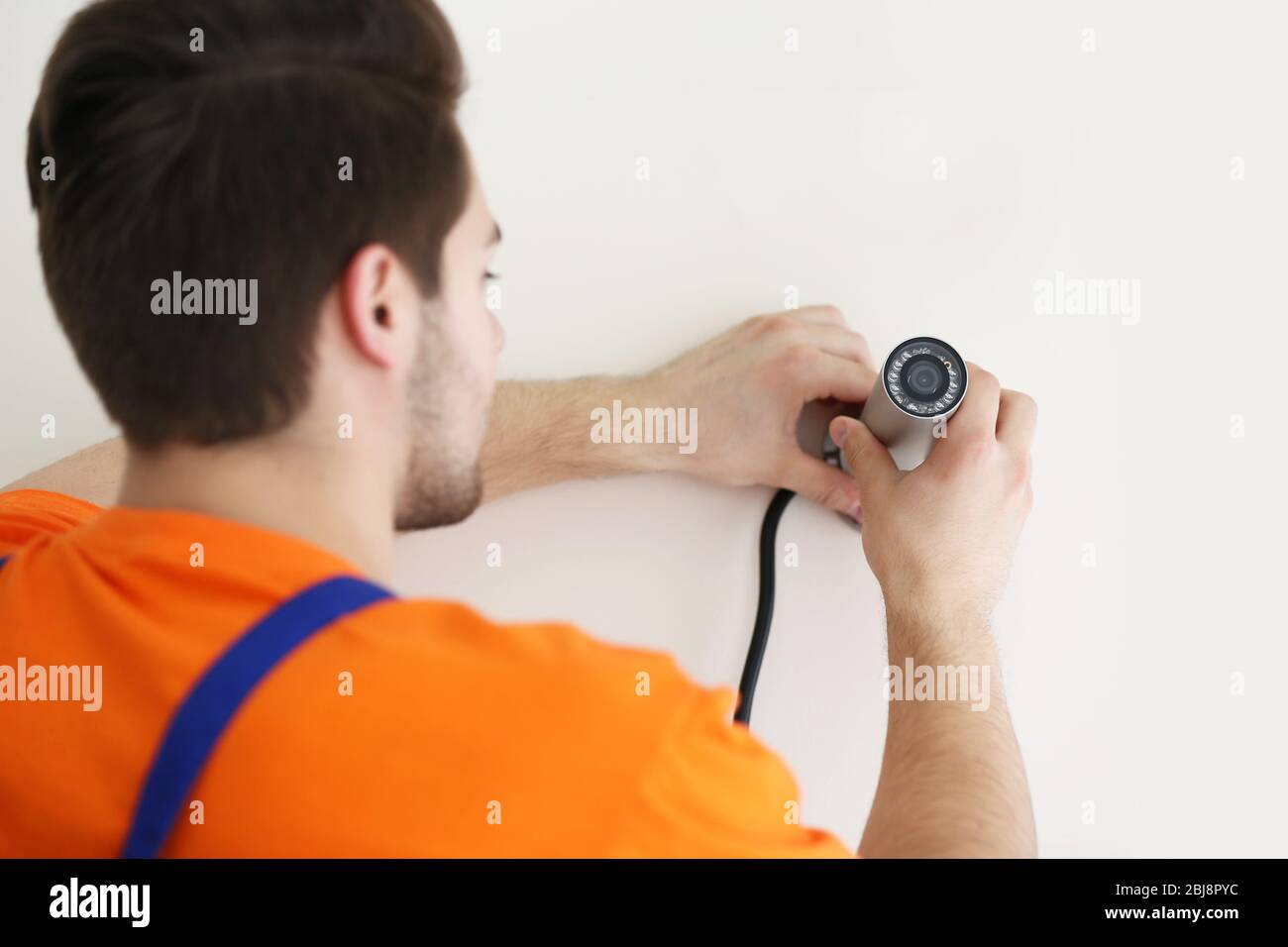 Professional CCTV technician working Stock Photo - Alamy
