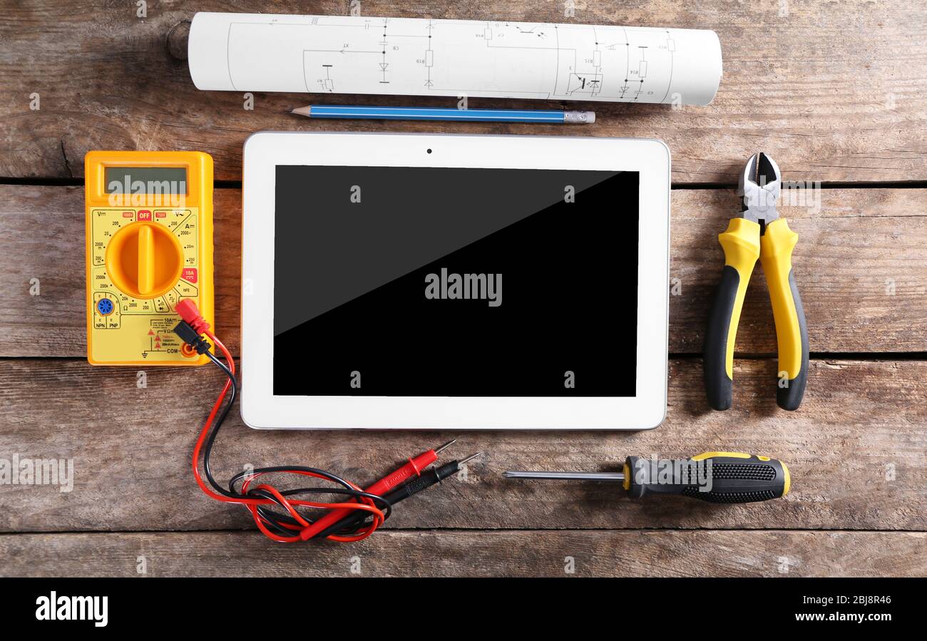 Electrical drawing with tools on wooden table, top view Stock Photo - Alamy