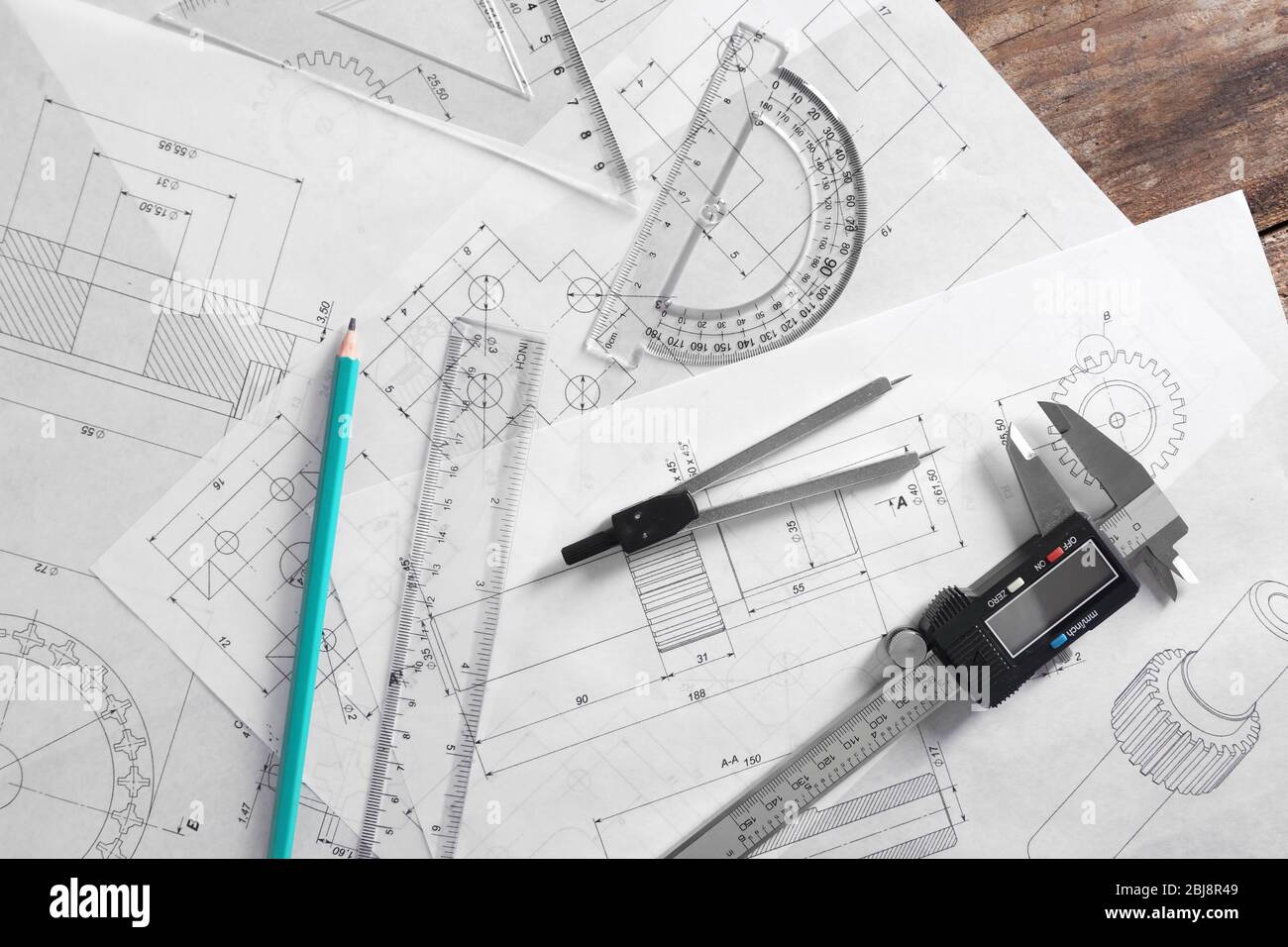 Set of engineering drawings with tools, top view Stock Photo - Alamy