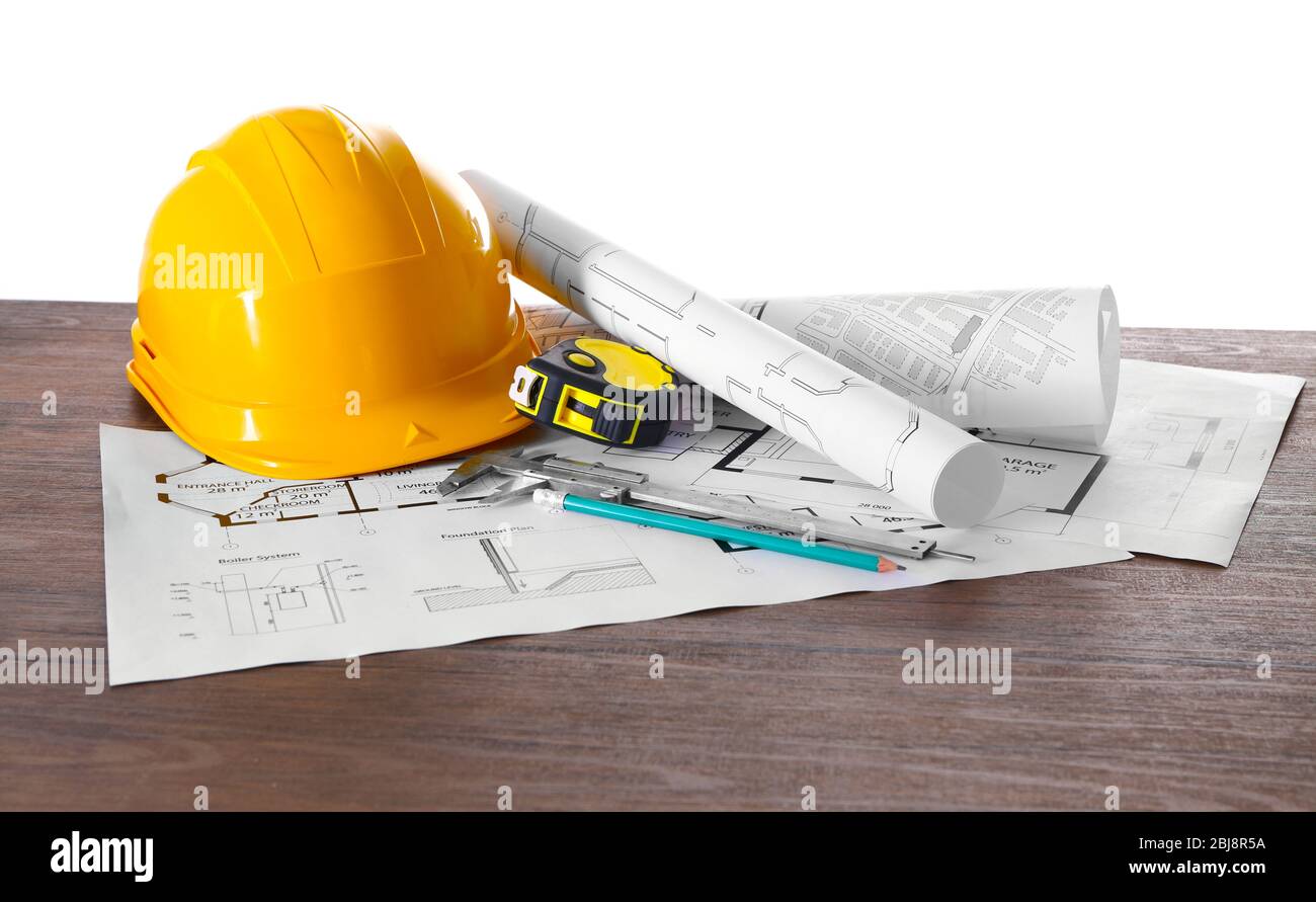 Construction blueprints with tools and helmet on white background Stock ...