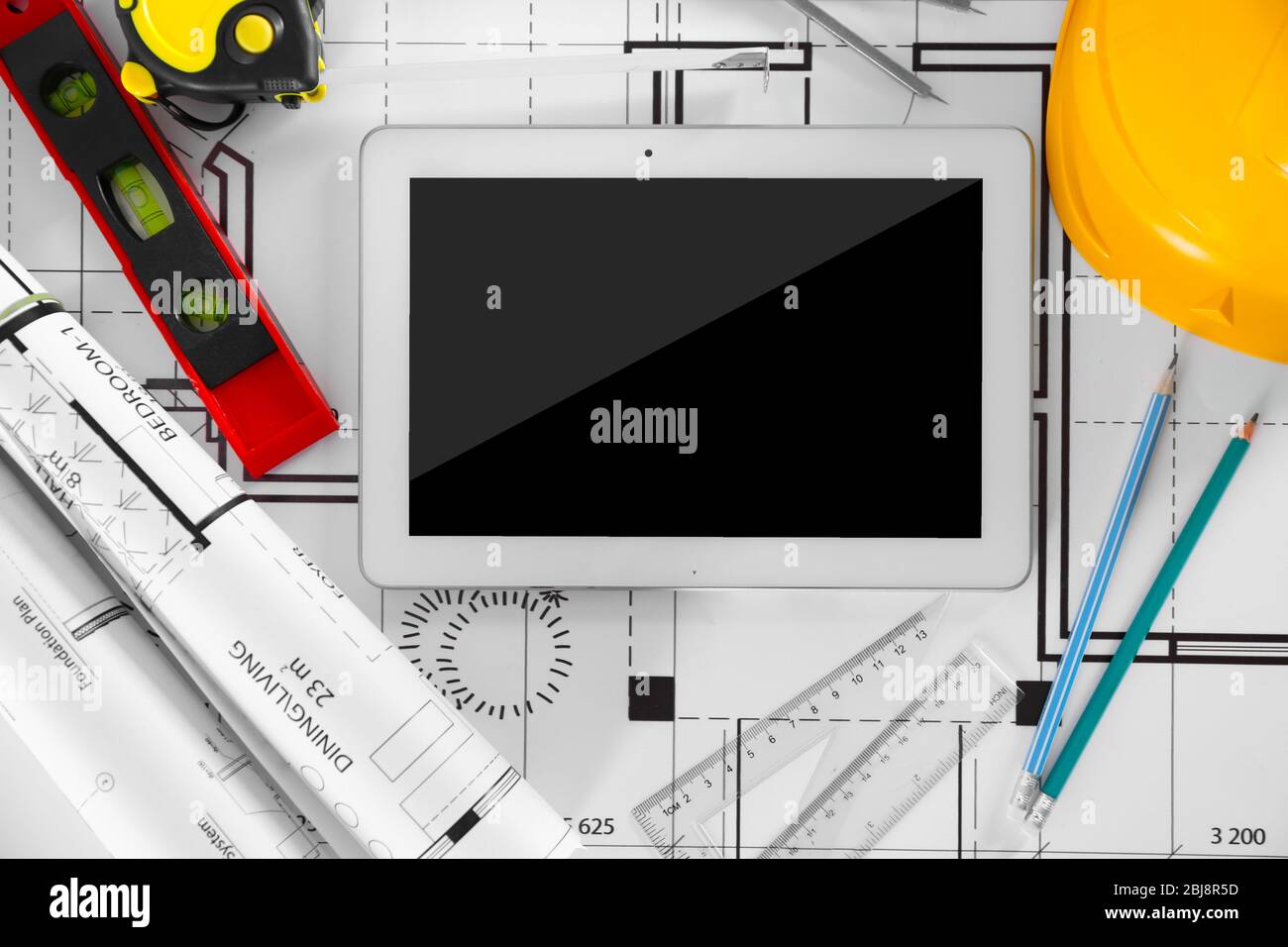 Construction blueprints with tools and tablet, top view Stock Photo - Alamy