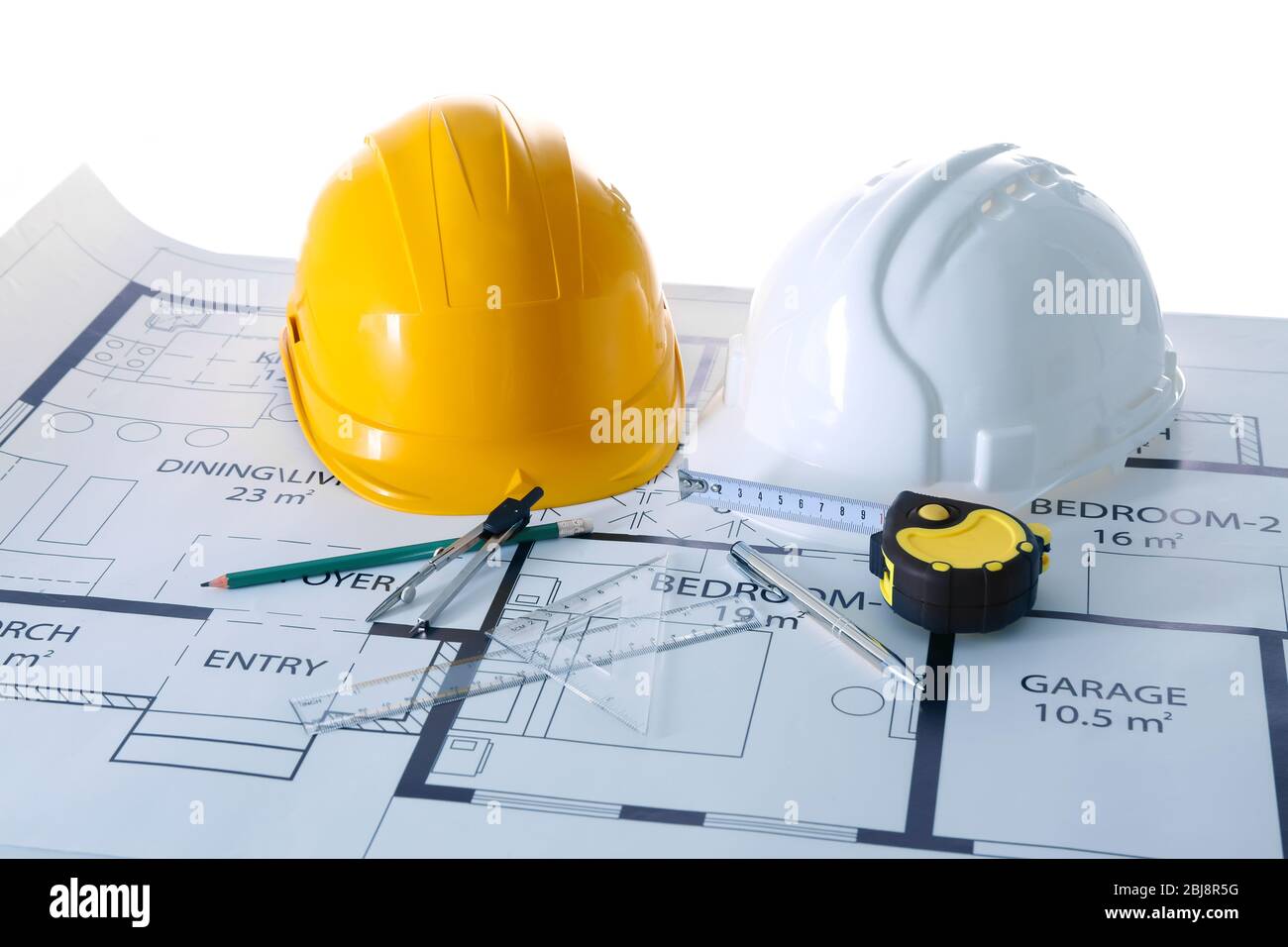 construction-blueprints-with-tools-and-helmet-on-white-background-stock