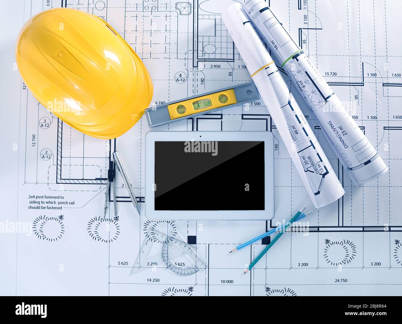Construction blueprints with tools and tablet, top view Stock Photo - Alamy
