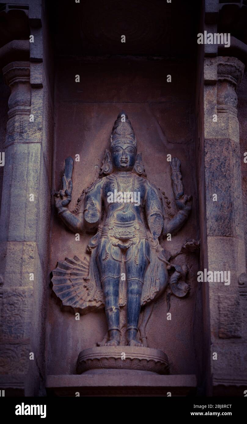 A tall statue of a Hindu god in a temple in South India Stock Photo - Alamy