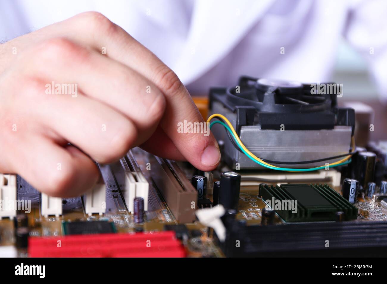 Male hands fixing electronic circuits closeup Stock Photo - Alamy