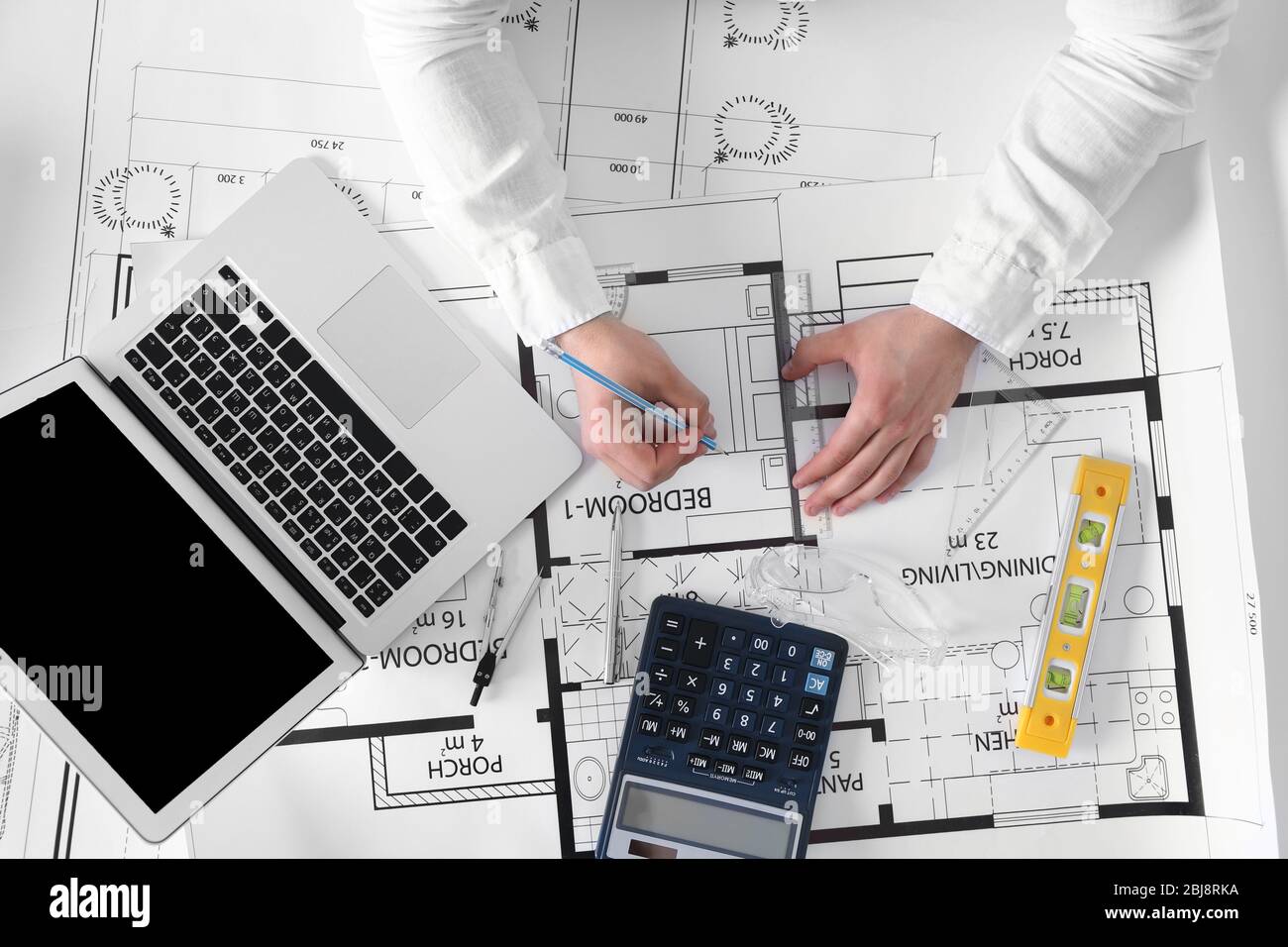 Architect sketching construction project, top view Stock Photo - Alamy