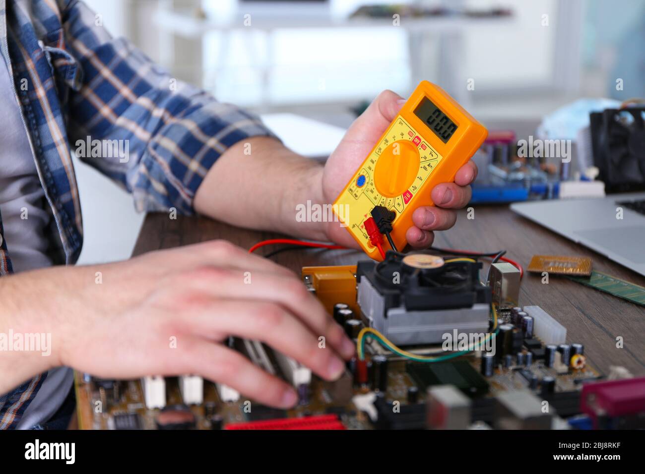 Male hands checking electronic hardware in service center Stock Photo ...