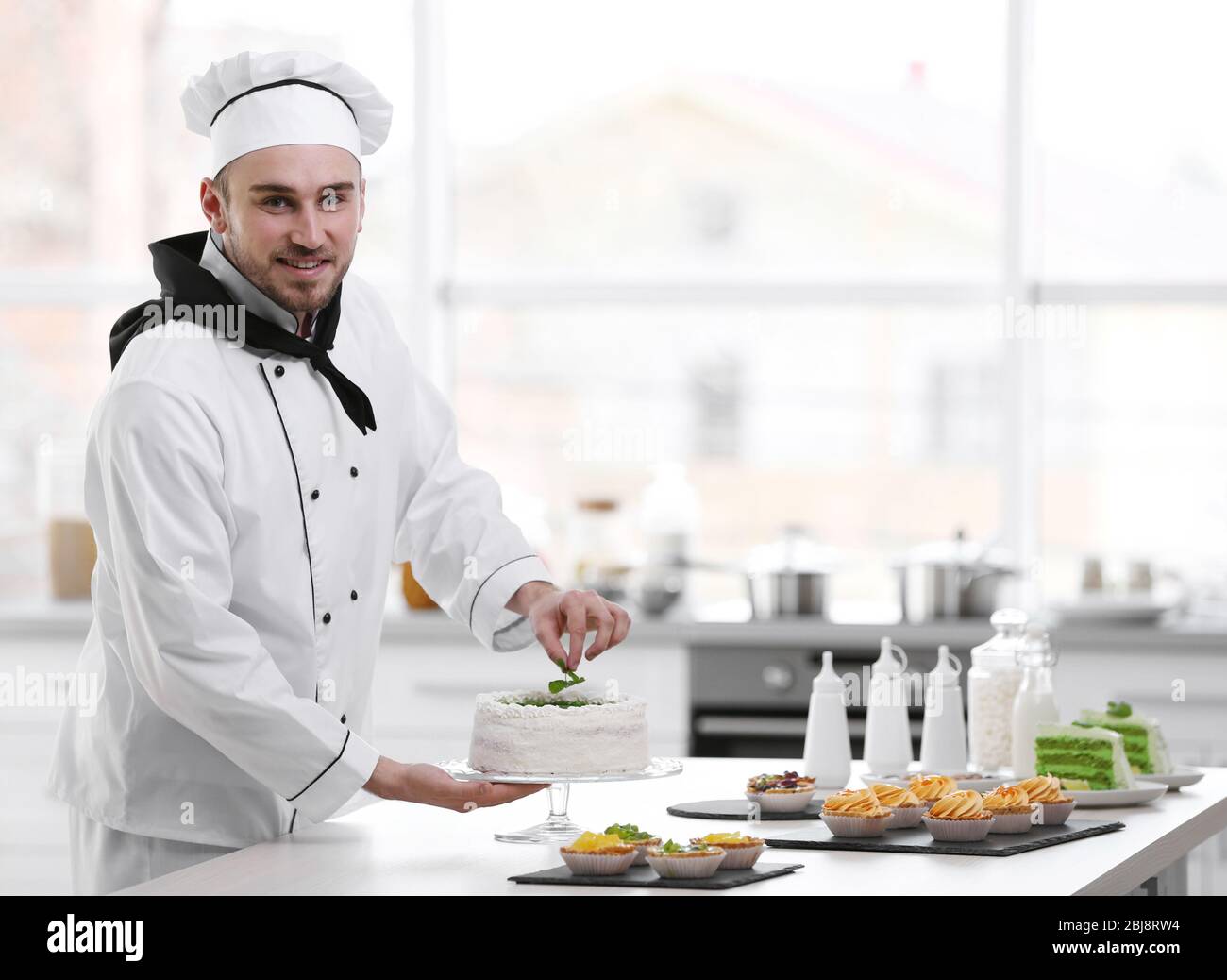 Male chef working at kitchen Stock Photo - Alamy