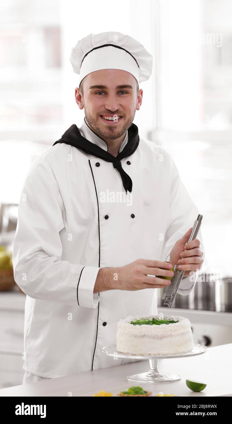 Male chef decorating cake hi-res stock photography and images - Alamy
