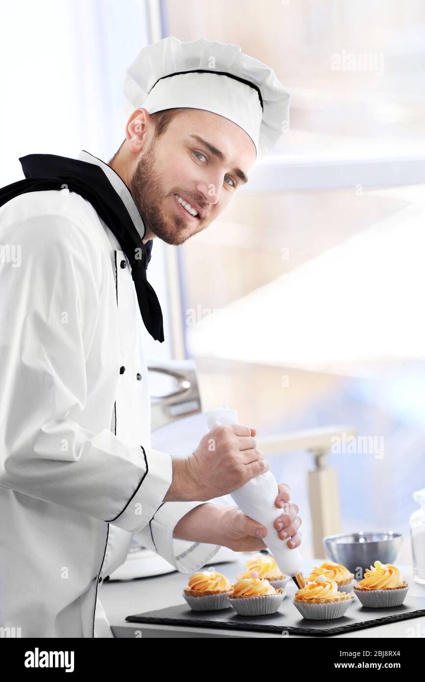 Male chef working at kitchen Stock Photo - Alamy
