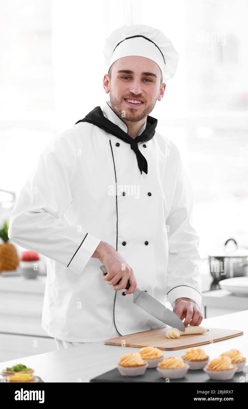 Male chef working at kitchen Stock Photo - Alamy