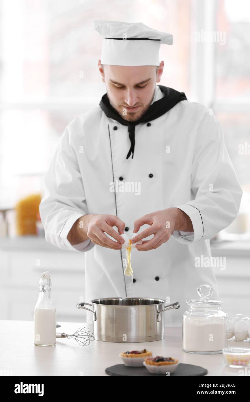 Male chef working at kitchen Stock Photo - Alamy