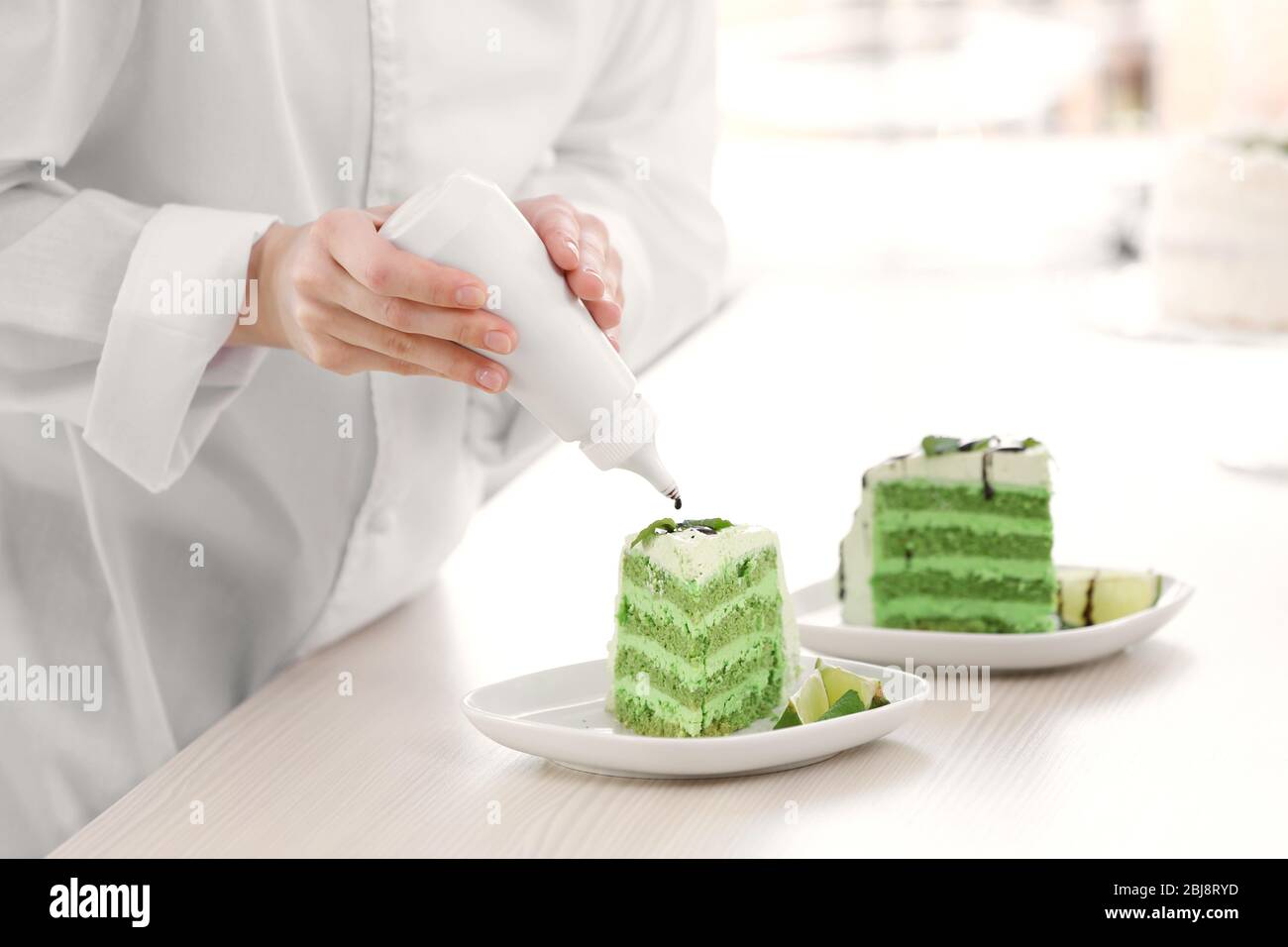 Female chef working at kitchen Stock Photo - Alamy